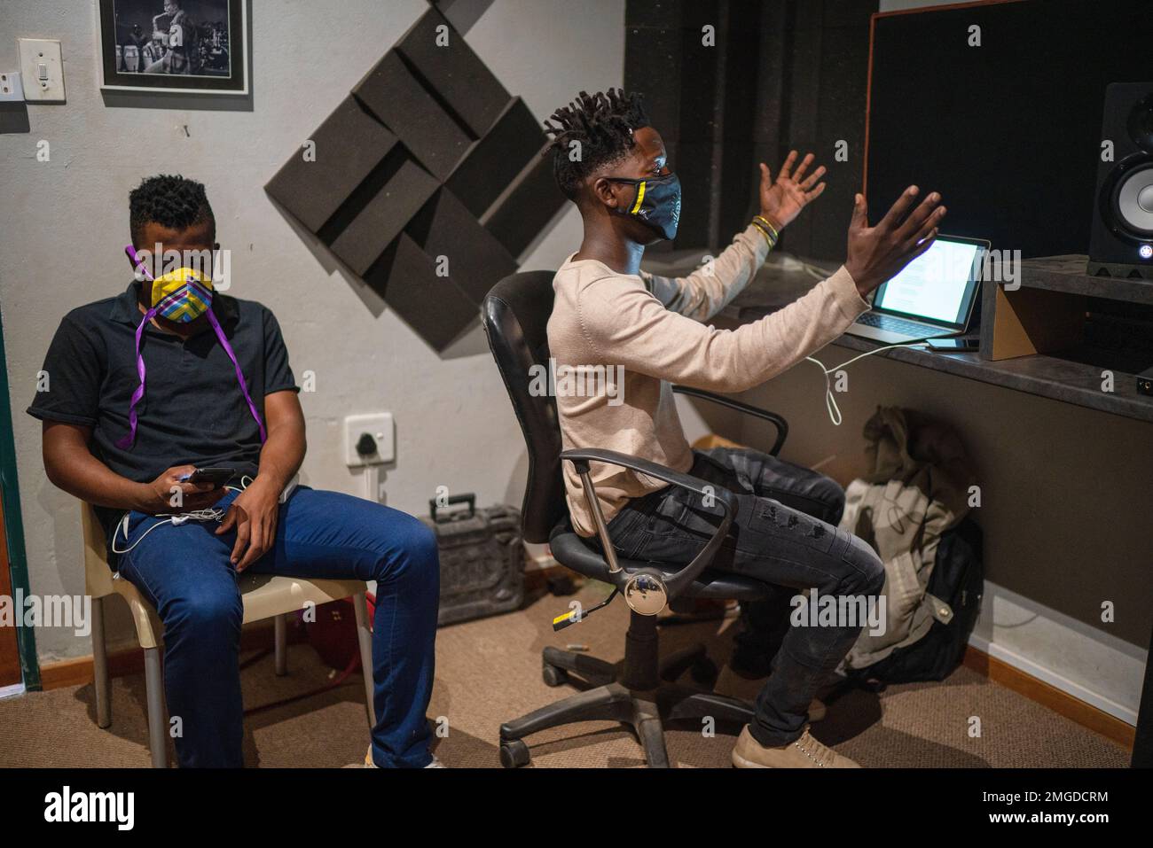 In this photograph taken Thursday May 21, 2020, Sandile Majola, right, rehearses a song with ...