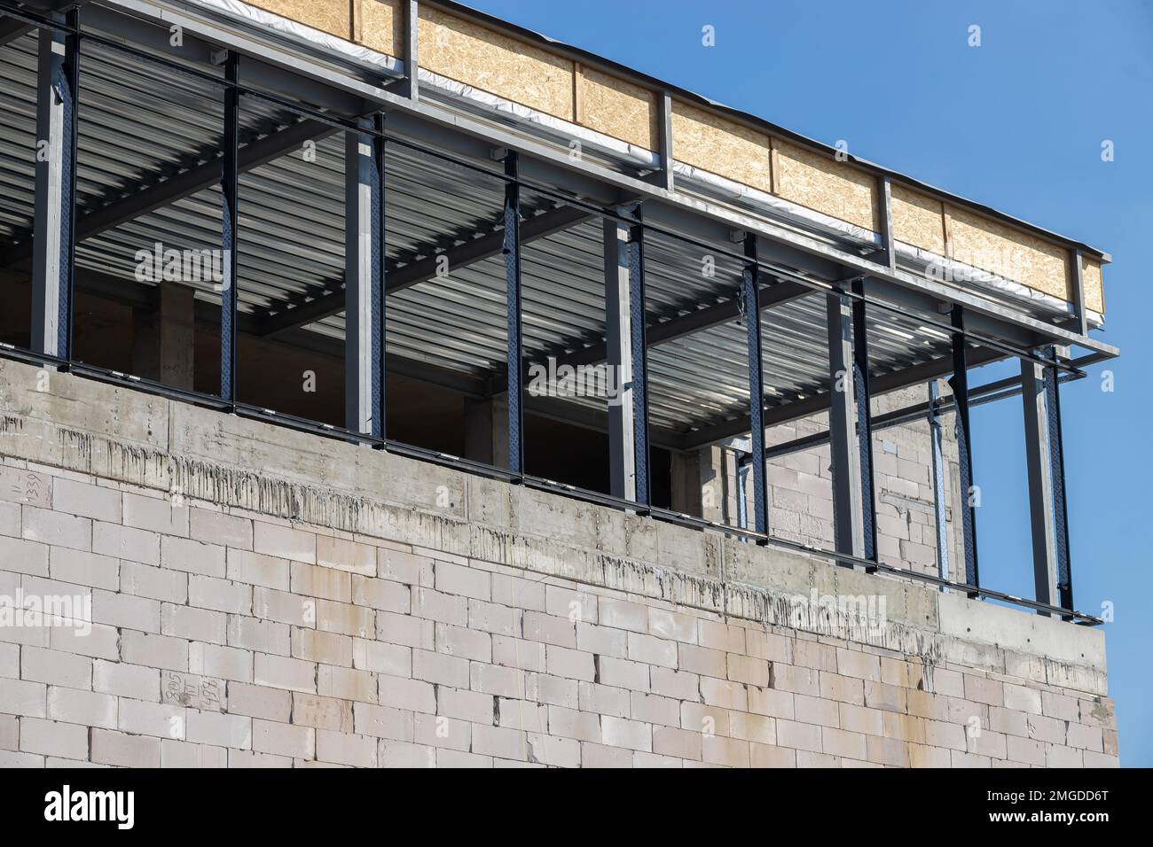 New home Construction of a cement block home with wooden roof trusses ...