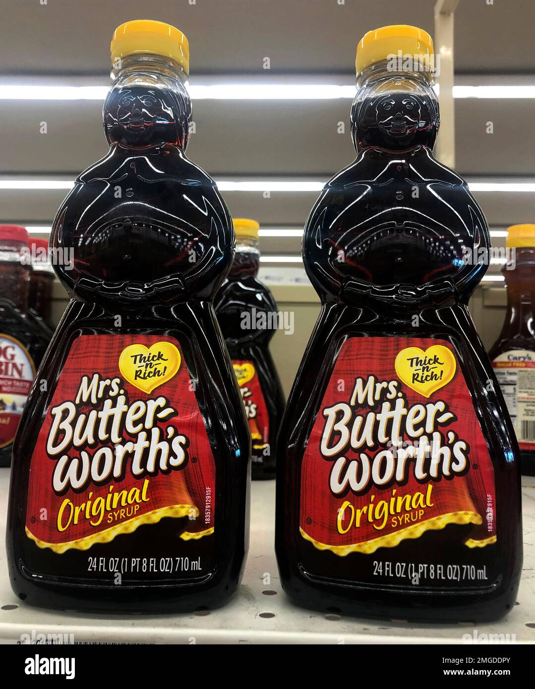 Bottles of Mrs. Butterworth's syrup are displayed at a grocery store on ...