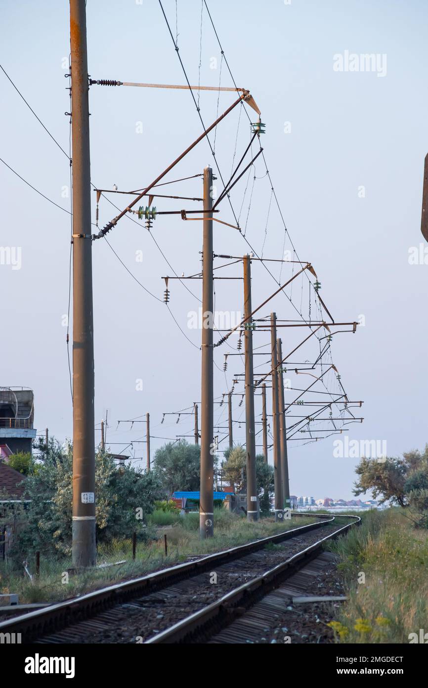 RAILWAY TRACK WITH LIGHT AND ELECTRIC POLE IN LANDSCAPE Stock Photo - Alamy