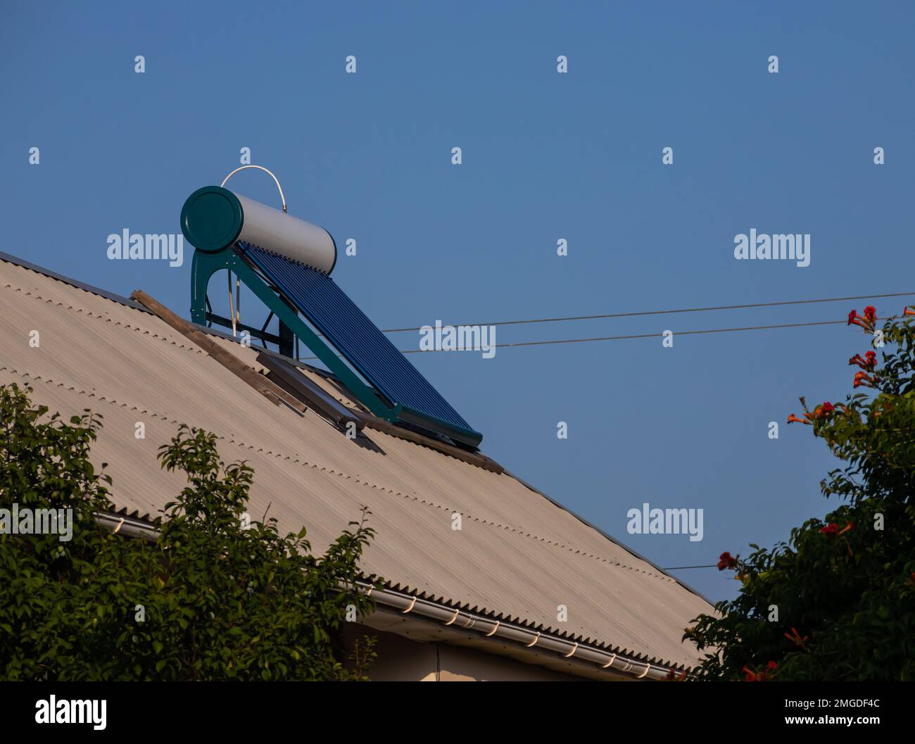 Solar water heater on roof top, beautiful blue sky background Stock ...