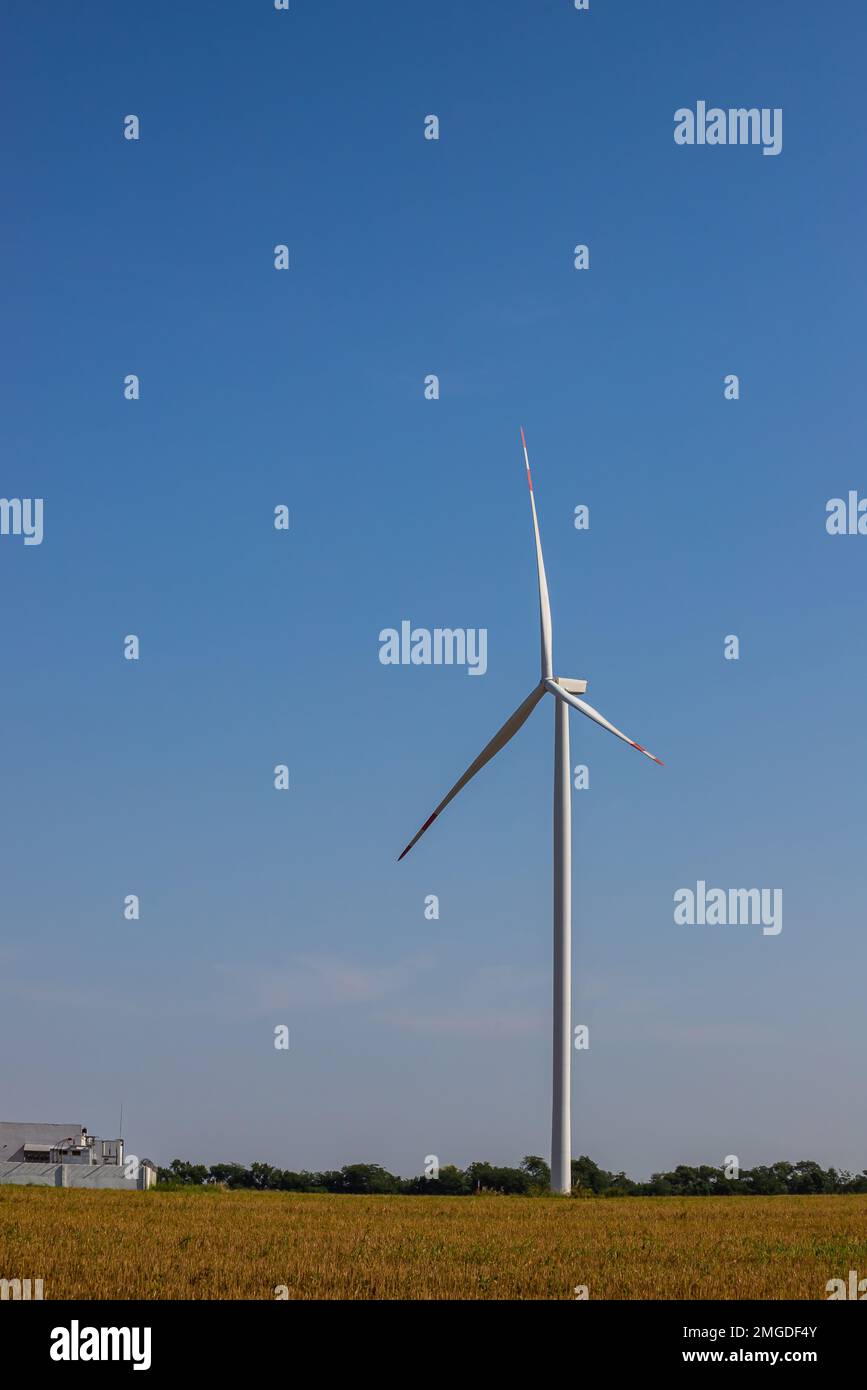 Wind generator installed in the middle of nature Stock Photo - Alamy