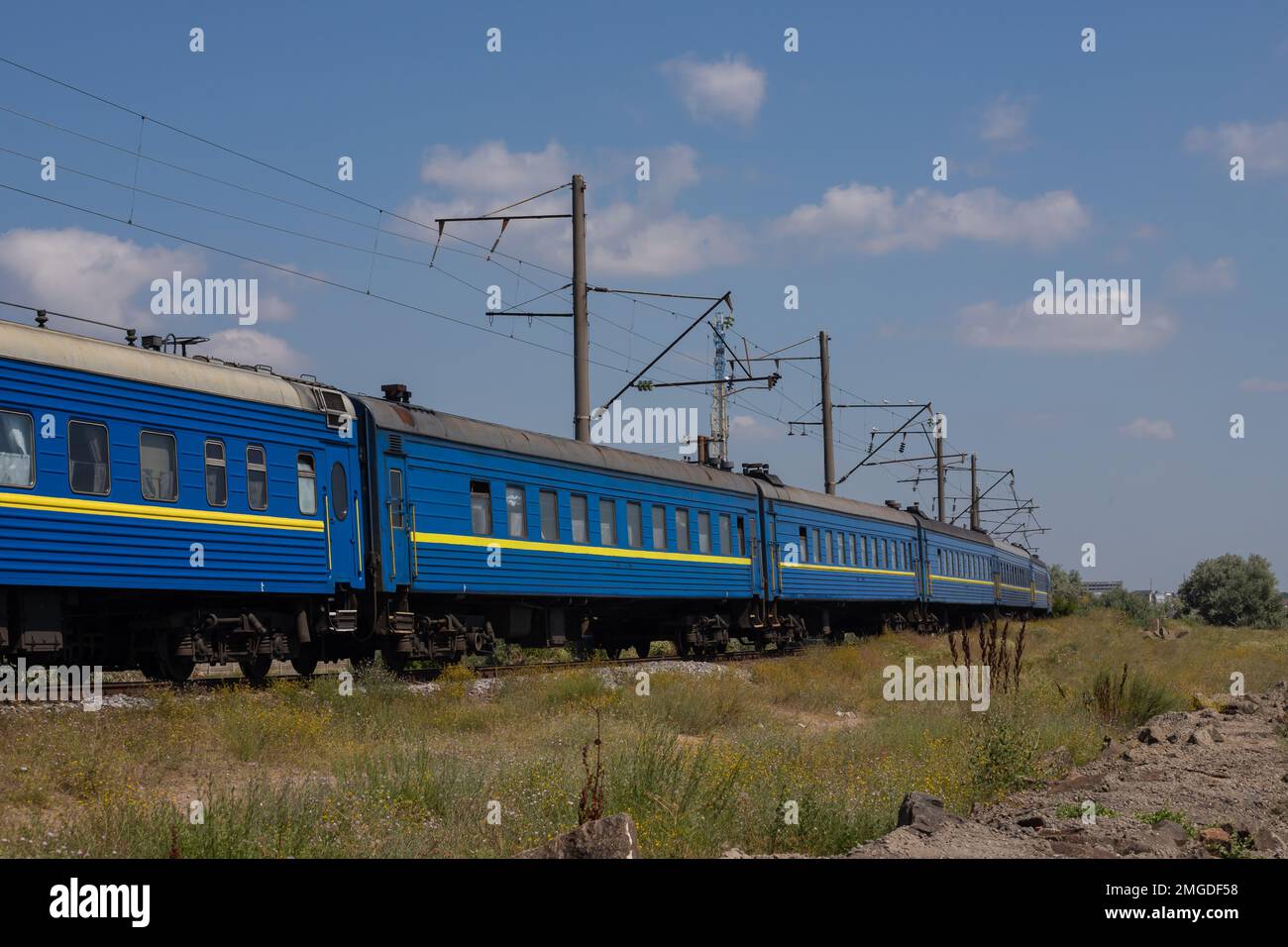 Old blue passenger train, carriages on a sunny summer day Stock Photo ...