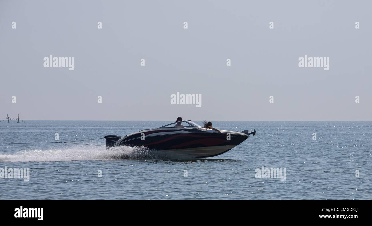 Small motorboat floats on sea hi-res stock photography and images - Alamy