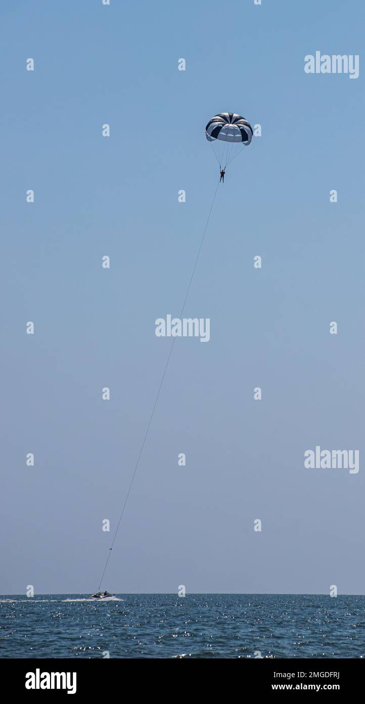 Parasailing is a popular type of outdoor activity at the sea. Parachute ...