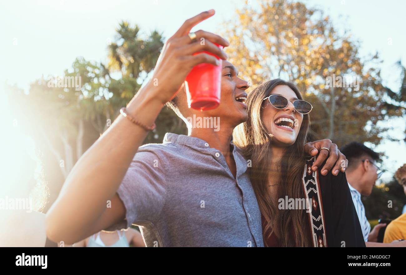Party, drinks and a couple of friends outdoor to celebrate at festival ...