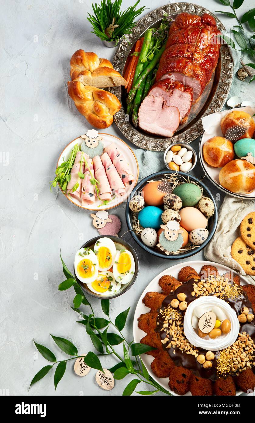 Classic Easter ham dinner. Top view table scene on a white background ...
