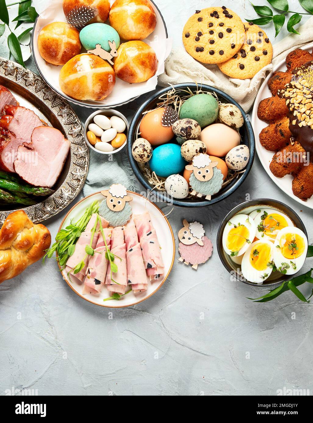 Classic Easter ham dinner. Top view table scene on a white background ...