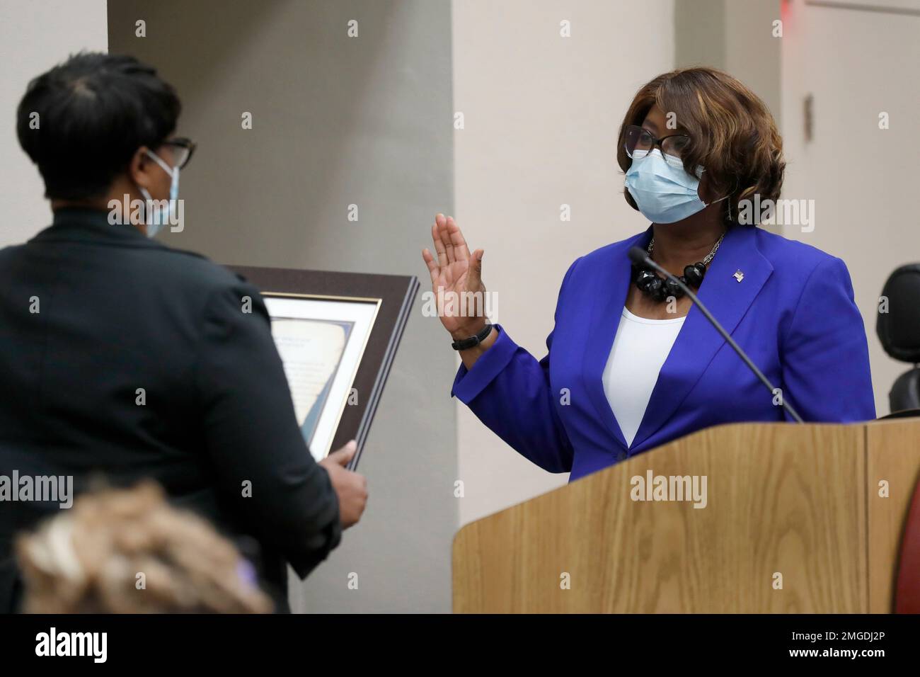 Ella Jones, right, is sworn in as mayor by city clerk Octavia Pittman ...