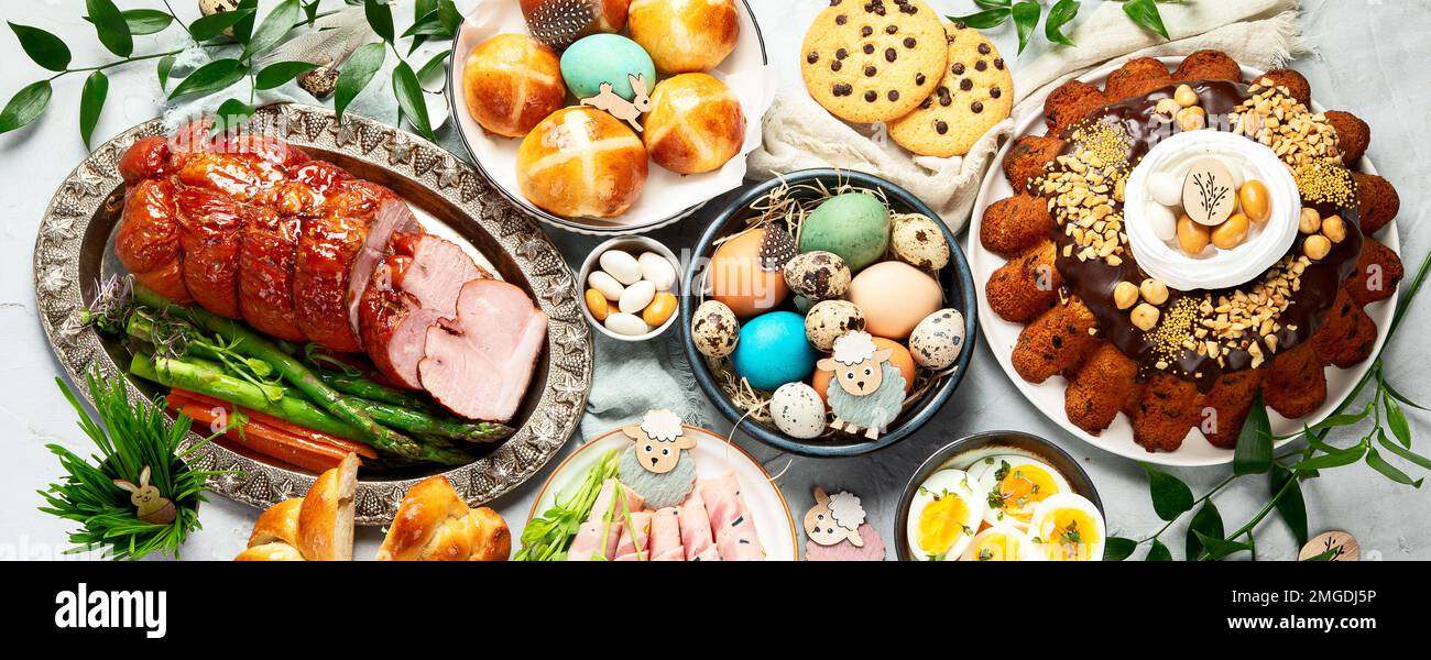 Classic Easter ham dinner. Top view table scene on a white background ...