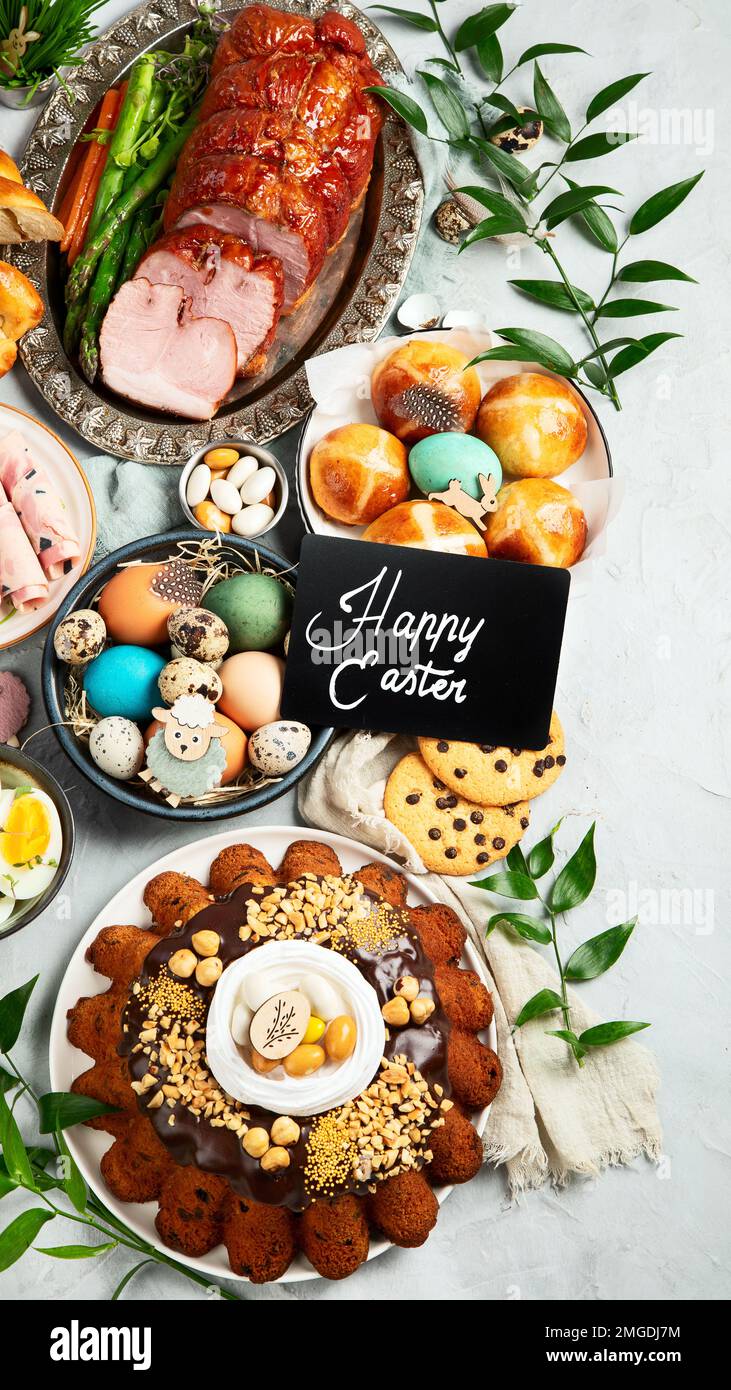 Classic Easter ham dinner. Top view table scene on a white background ...