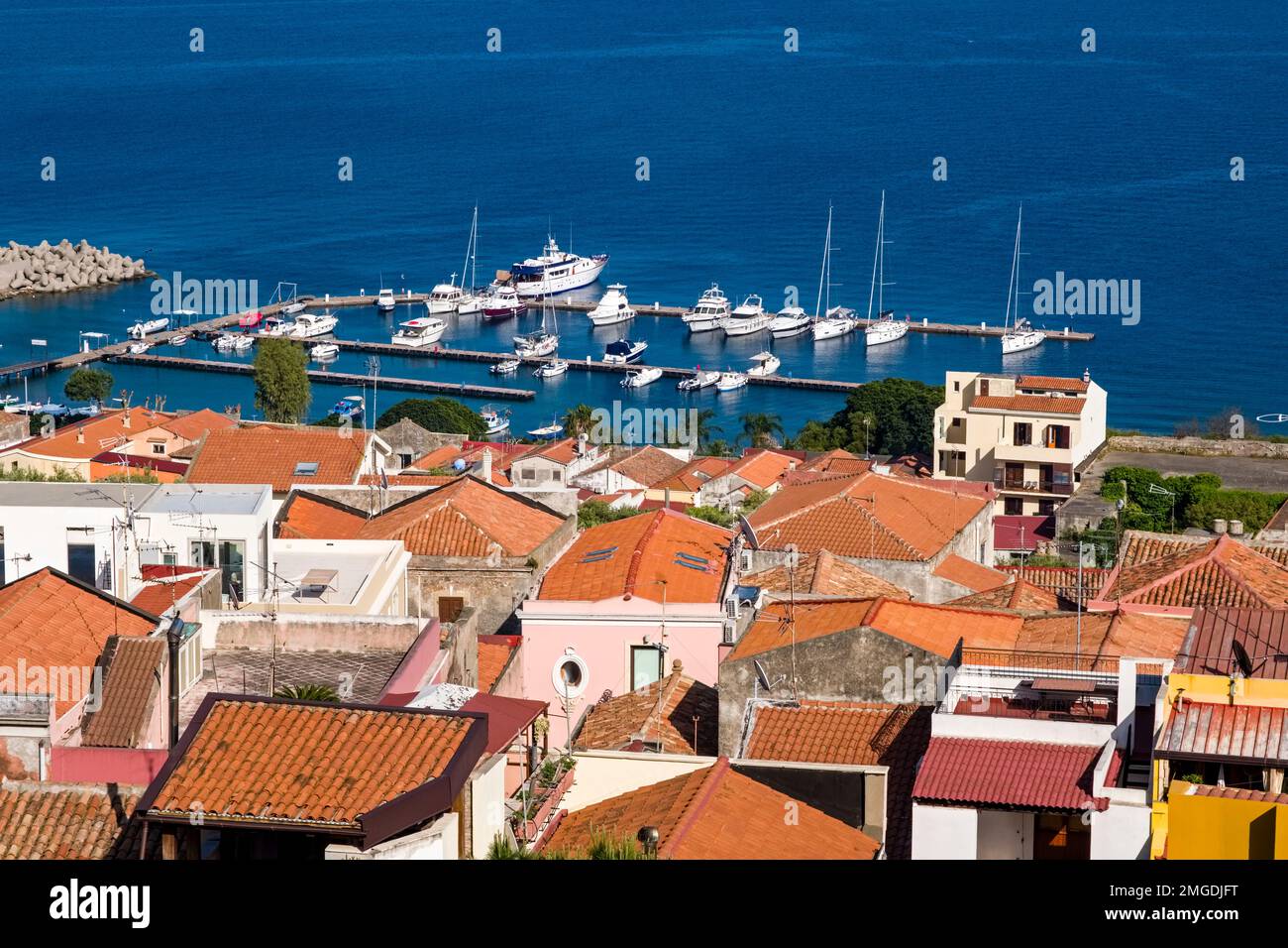Aerial view of the harbour of Milazzo with anchored boats, seen over ...