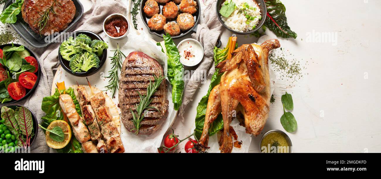 Various types of healthy cooked meat - beef, pork, chicken on a light ...