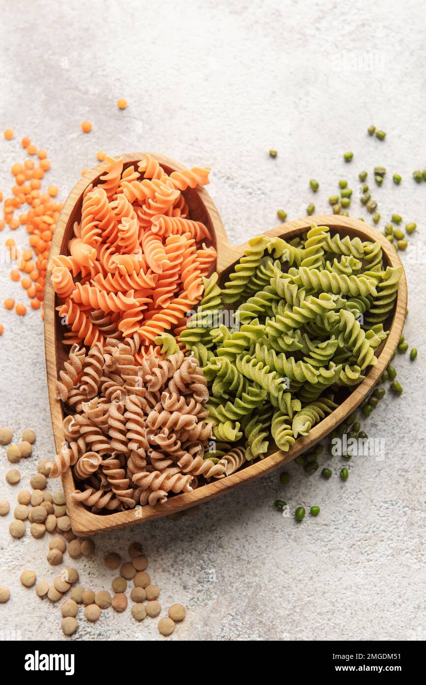 A variety of fusilli pasta made from different types of legumes, green ...
