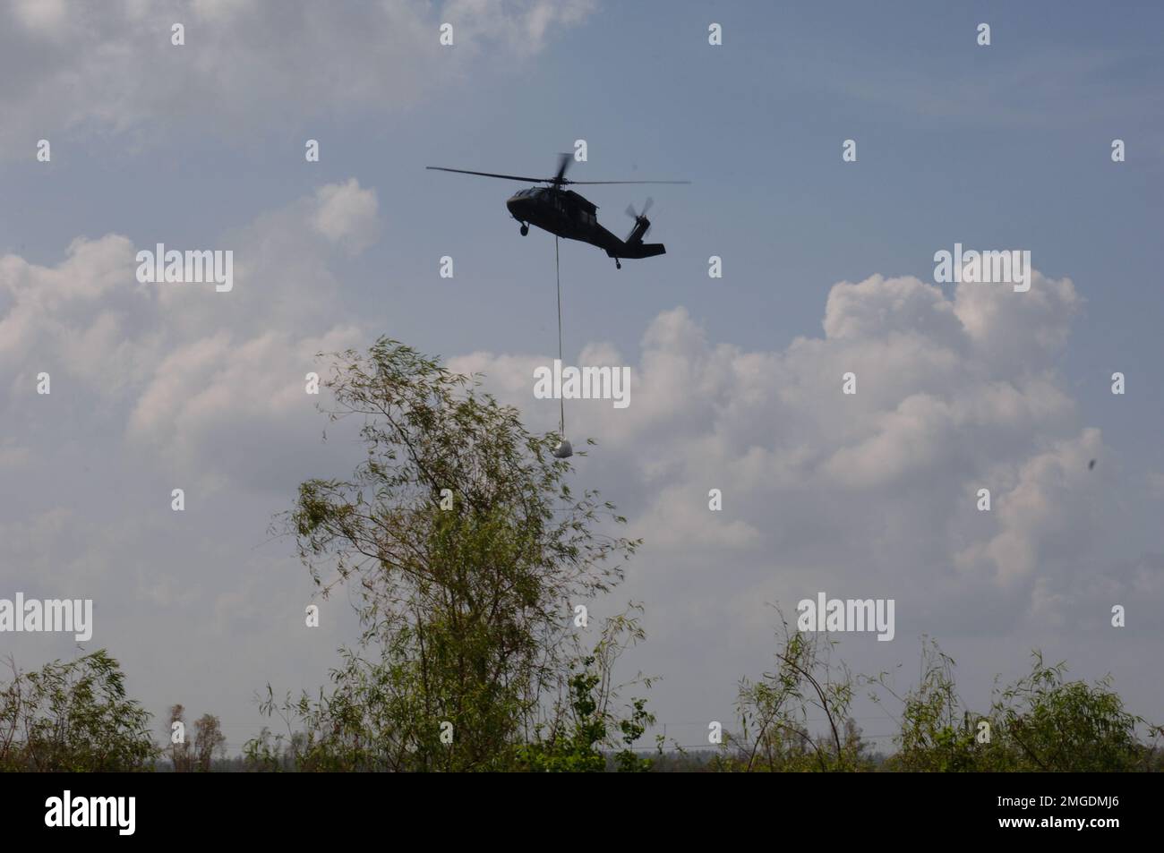 Aircrafts - Sand Baggers - 26-HK-57-36. Helicopter flying with sand bag ...
