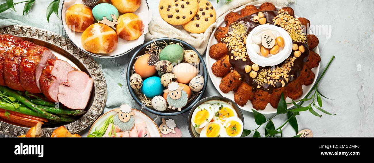 Classic Easter ham dinner. Top view table scene on a white background ...