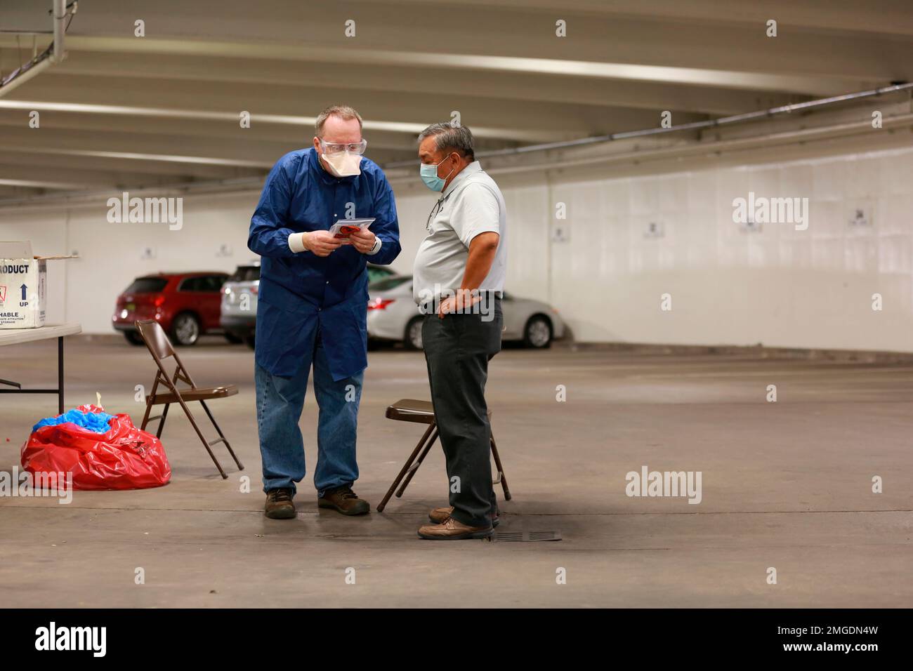 State Sen. Benny Shendo, right, speaks with a healthcare worker before ...