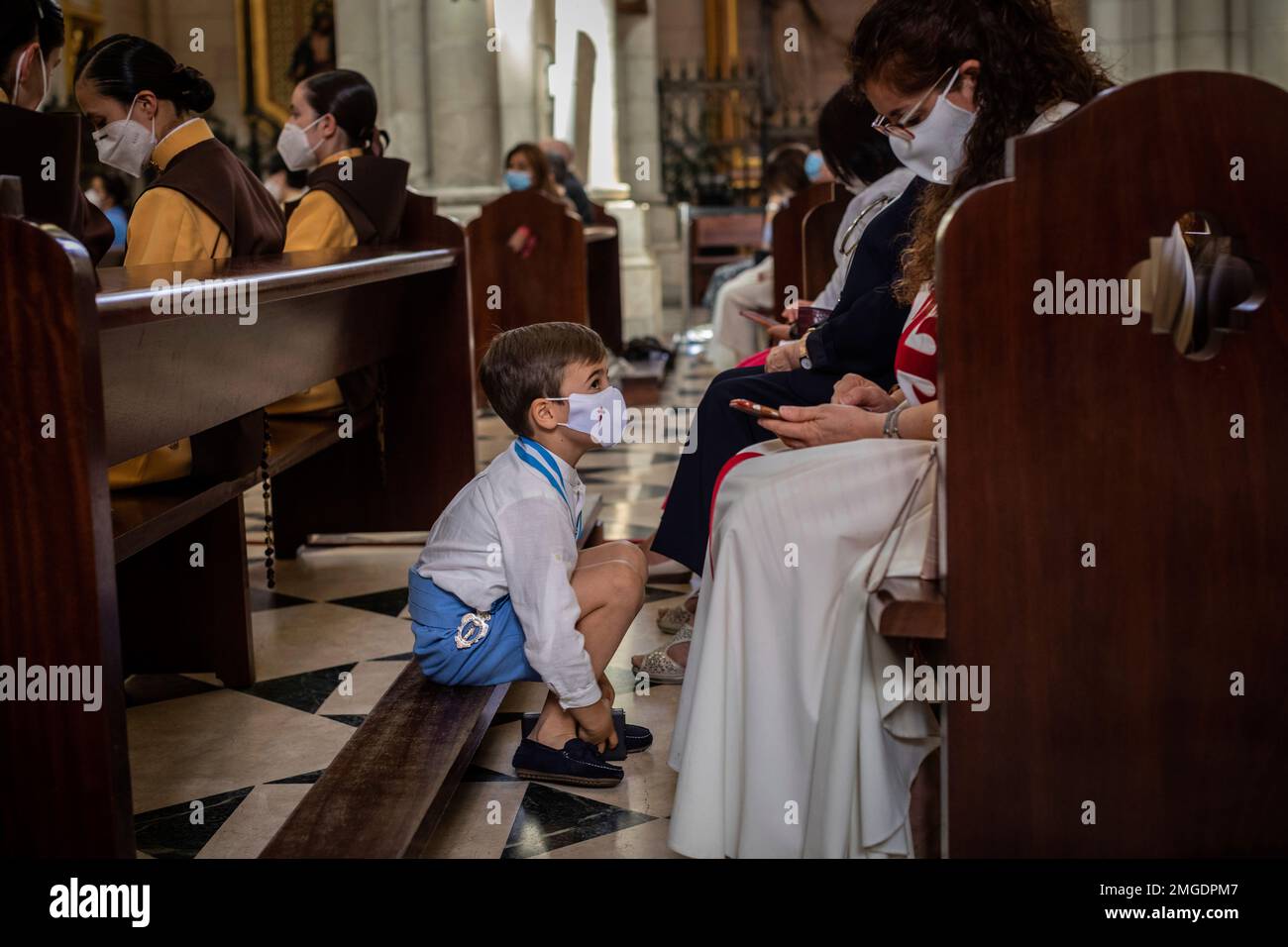 Catholic worshippers, wearing protective face masks as a measure to ...