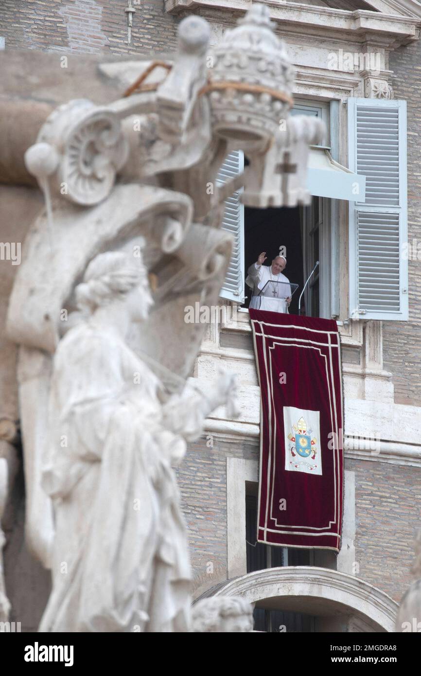 Pope Francis waves from the window of his studio overlooking St. Peter ...
