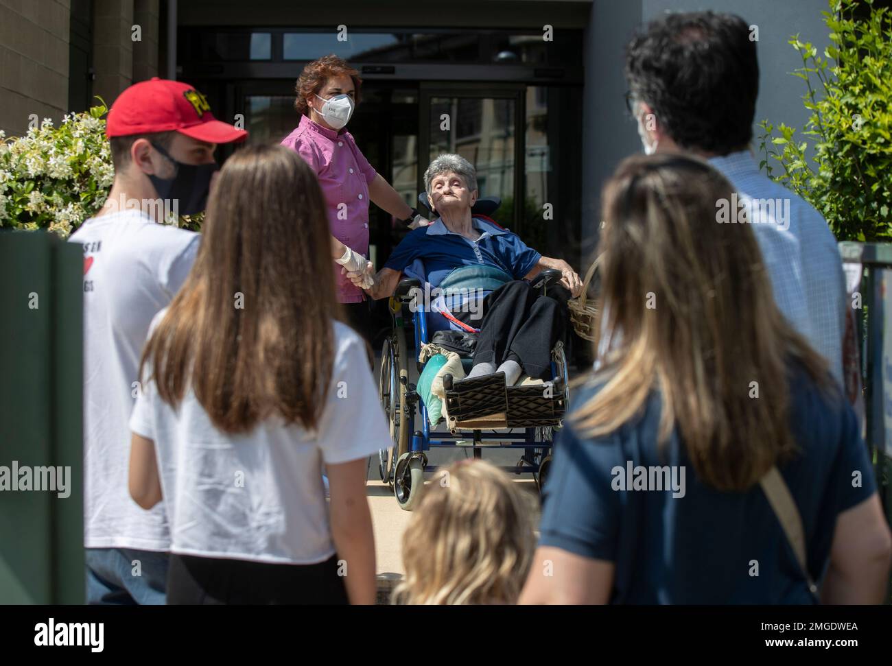 Anna Maria Alborghetti sits in a wheelchair as carer Melania Cavalieri ...