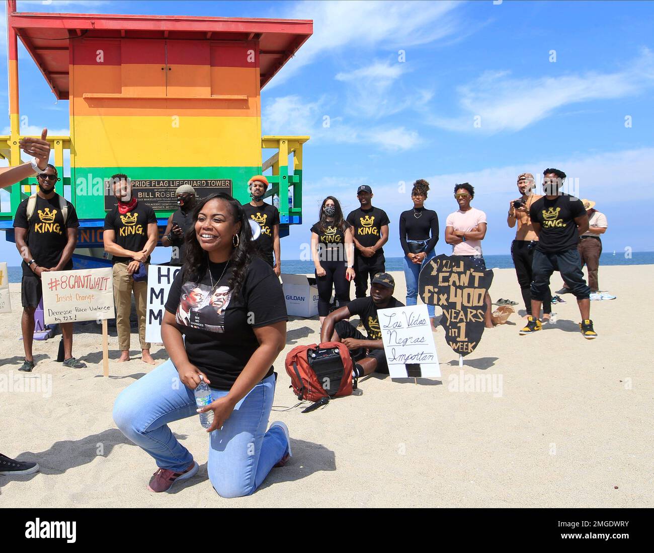 Lora King, Rodney King's daughter, kneels as she addresses supporters ...