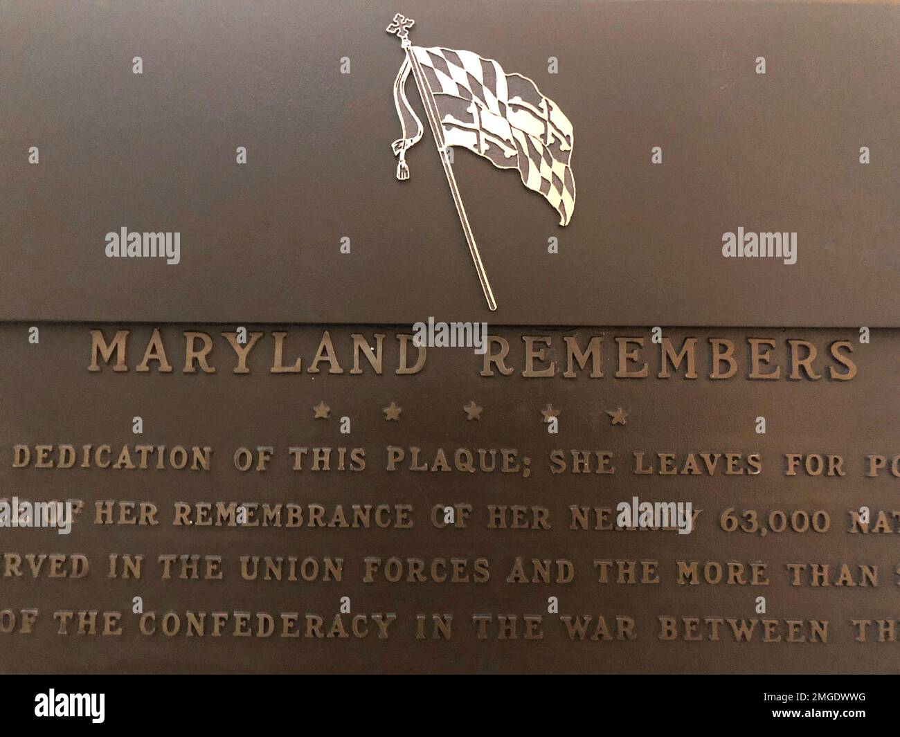 The flag of the state of Maryland covers a part of a plaque ...