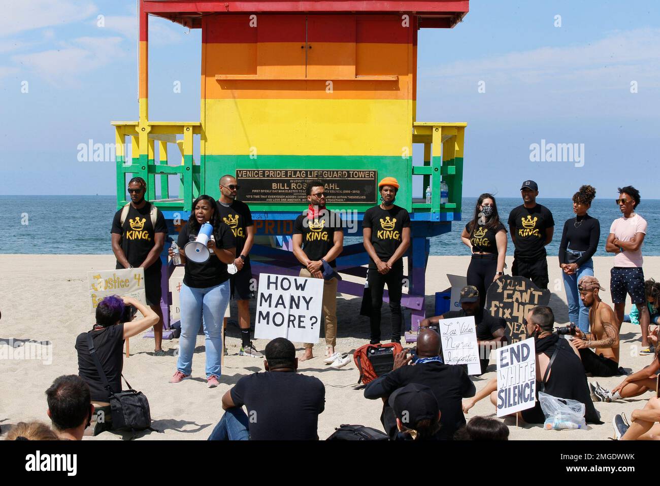 Lora King, Rodney King's daughter, left with the megaphone, holds a ...