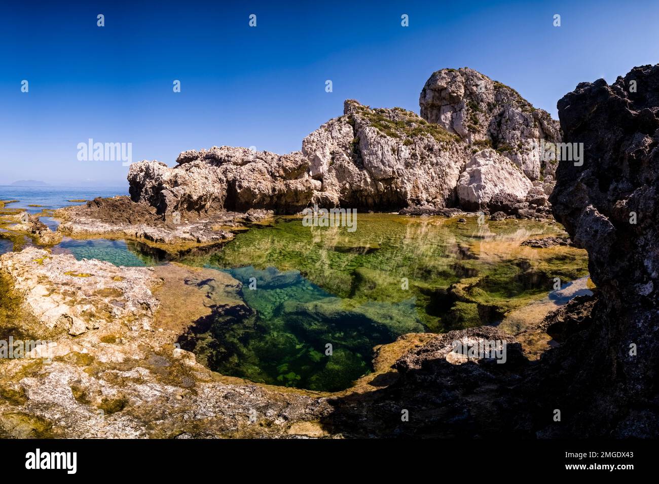 Pool of Venus, Piscina di Venere, a beautiful pool surrounded by rocks ...