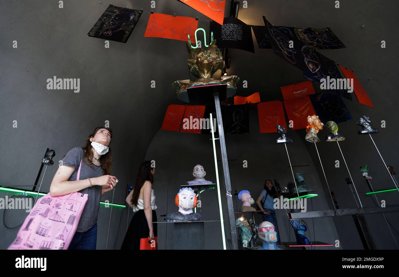 Visitors view an exhibition by Czech artist Michal Cimala that was ...