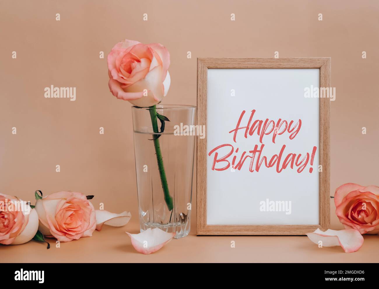 Mockup Wooden frame with text HAPPY BIRTHDAY on blank and delicate pink ...