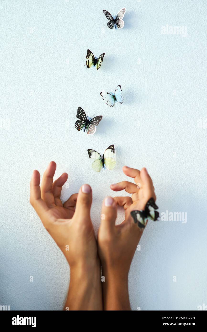 Soar to your dreams. Studio shot of an unrecognizable person releasing ...