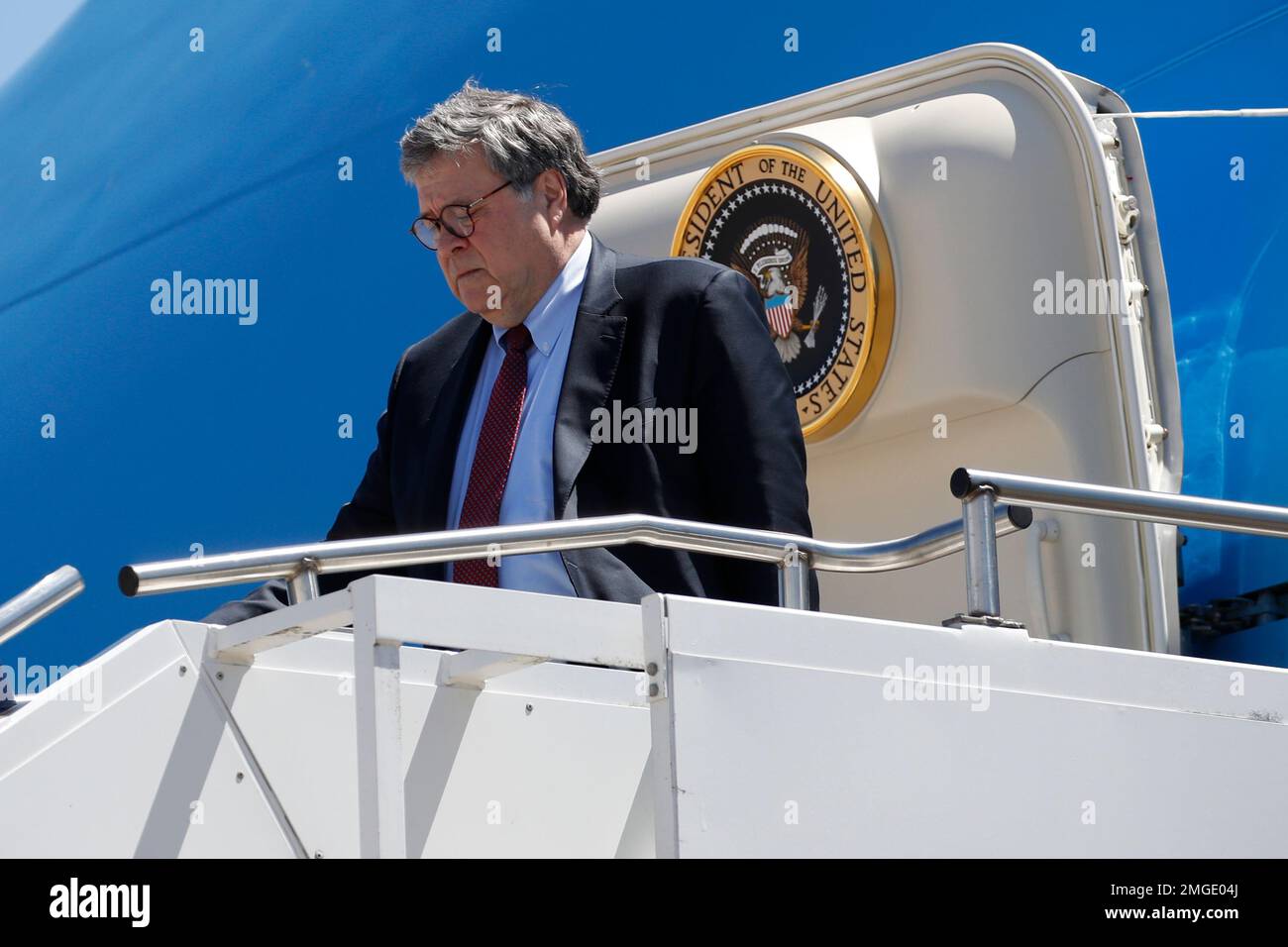 Attorney General William Barr follows President Donald Trump as he ...