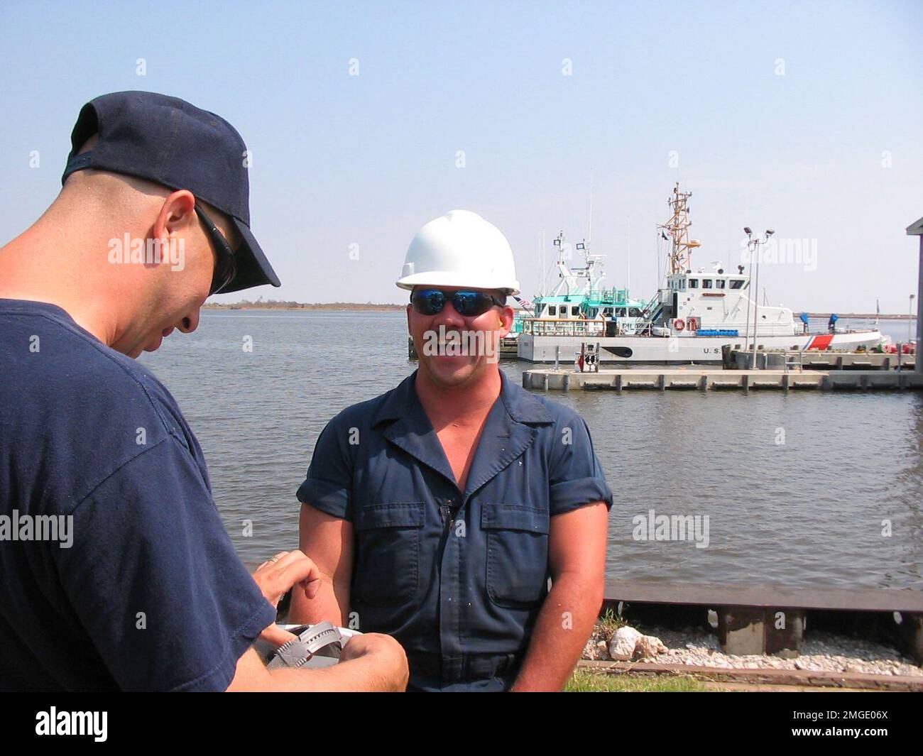Station Sabine, Texas - 26-HK-2-2. Coast Guard personnel near dock with ...