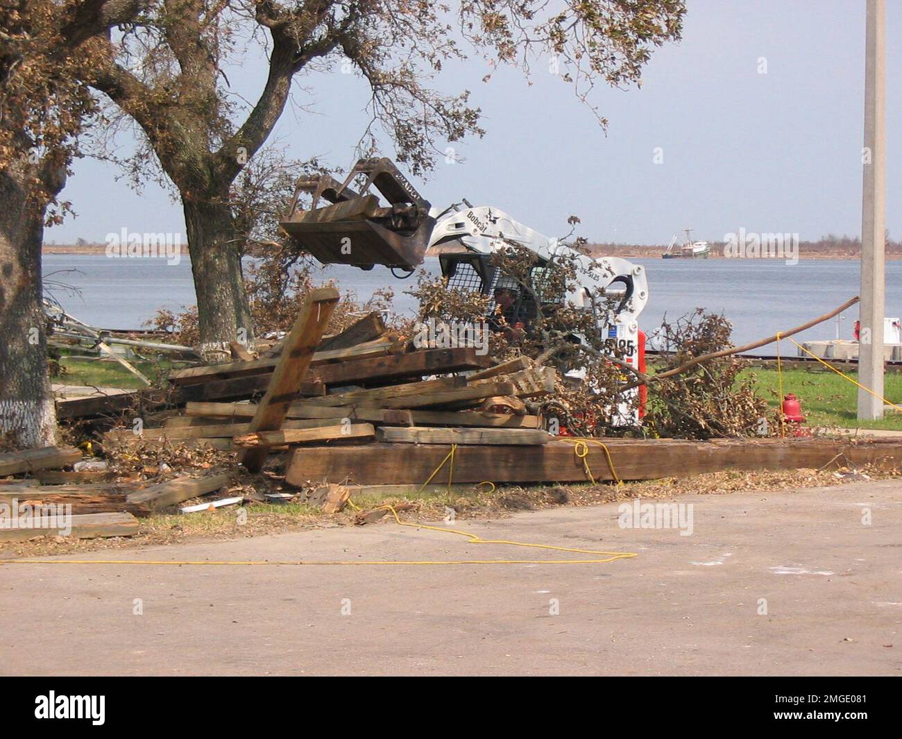 Station Sabine, Texas - 26-HK-2-8. Front loader clearing wood pilings ...