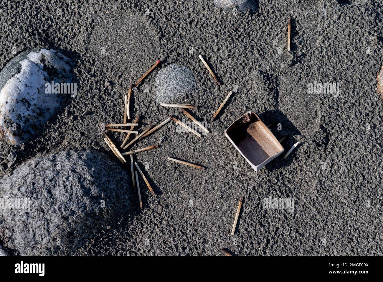 Burnt match sticks on the beach Stock Photo - Alamy