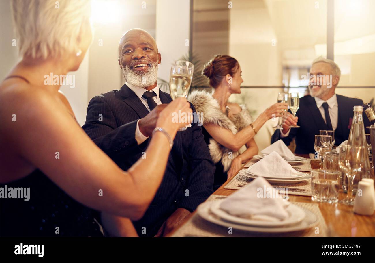 Man, toast and friends at restaurant party in night for diversity ...