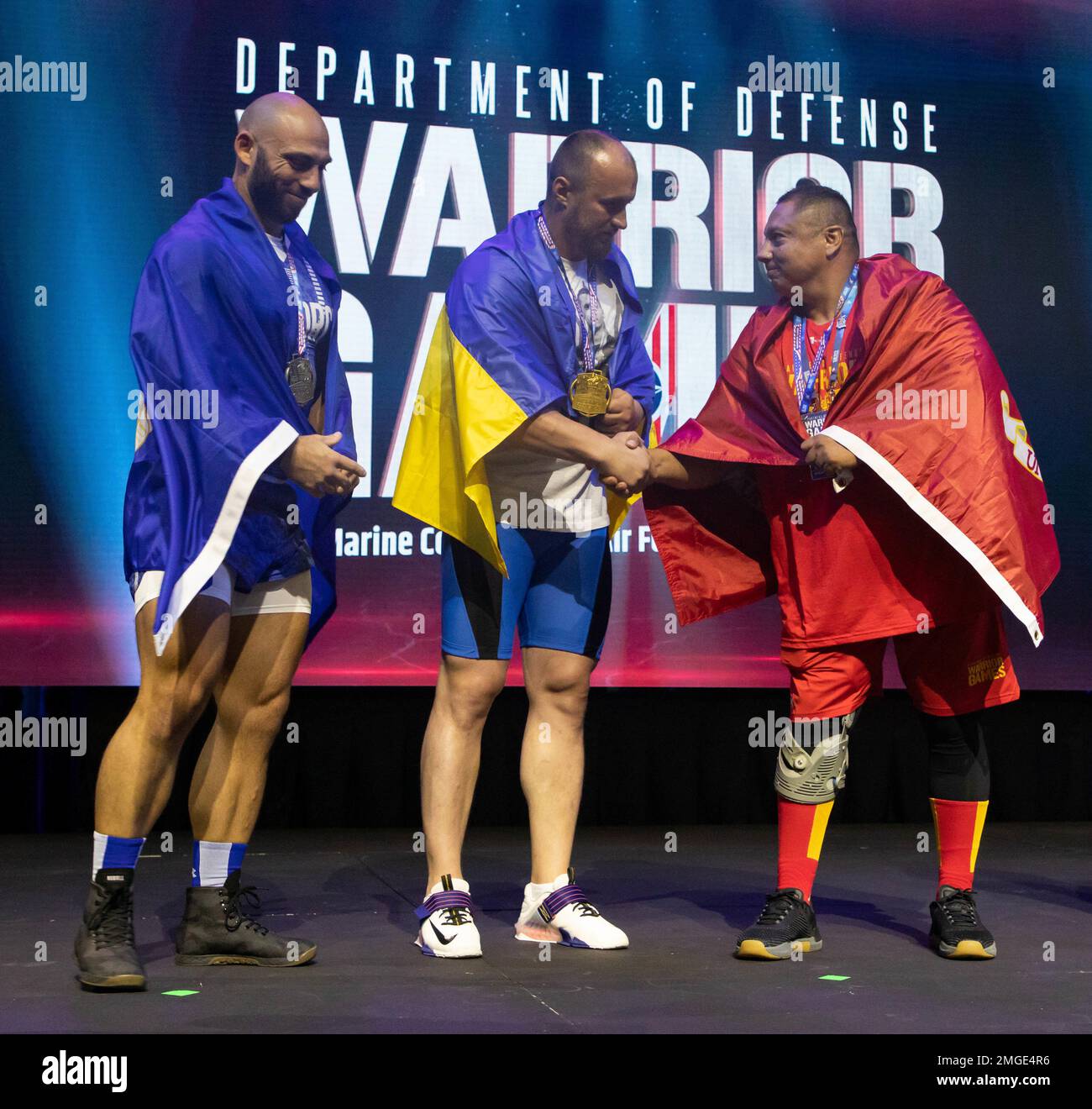 U.S. Marine Corps Staff Sgt. Raymond Cardoza receives a bronze medal ...