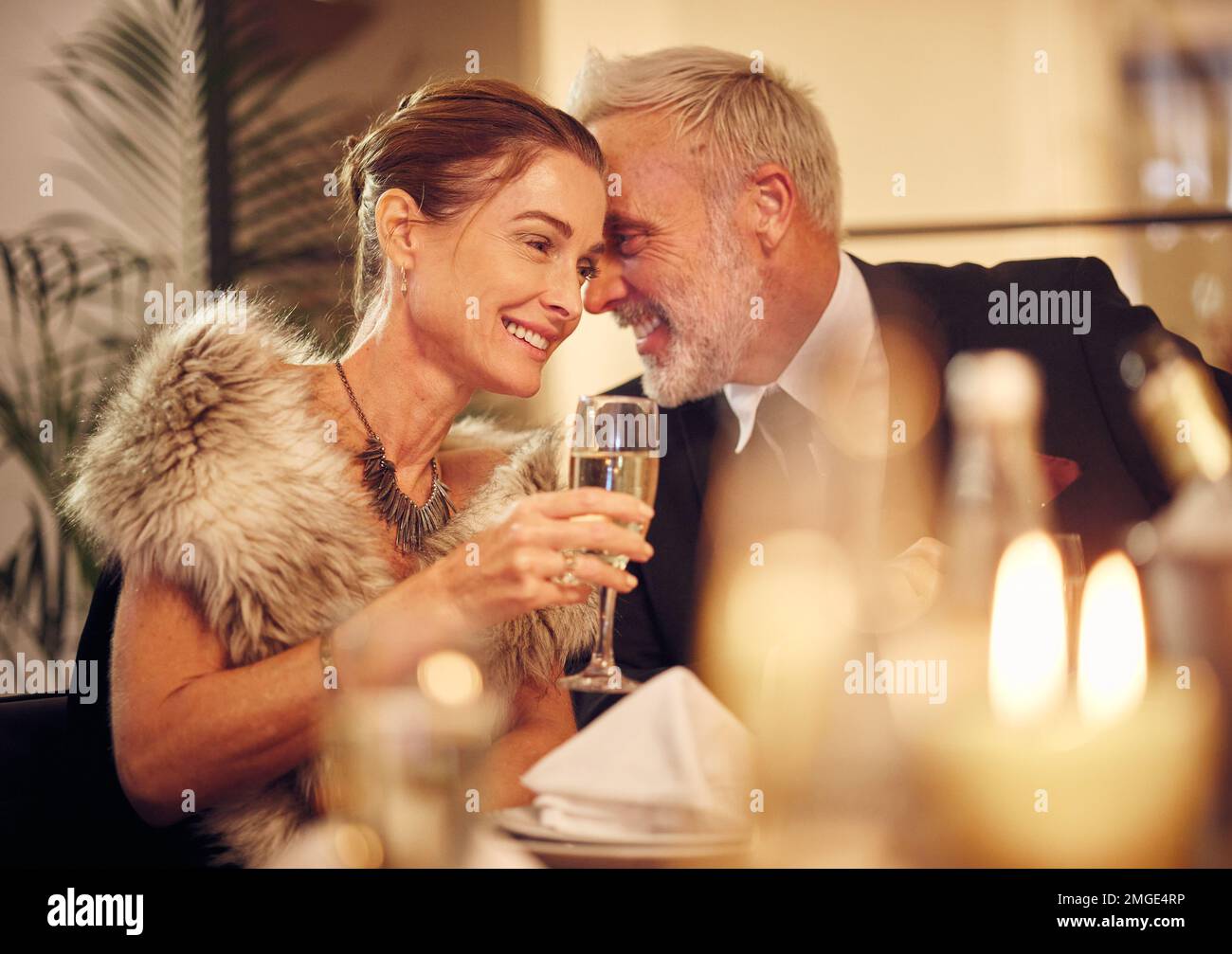 Elderly man dinner laughing young woman hi-res stock photography and ...