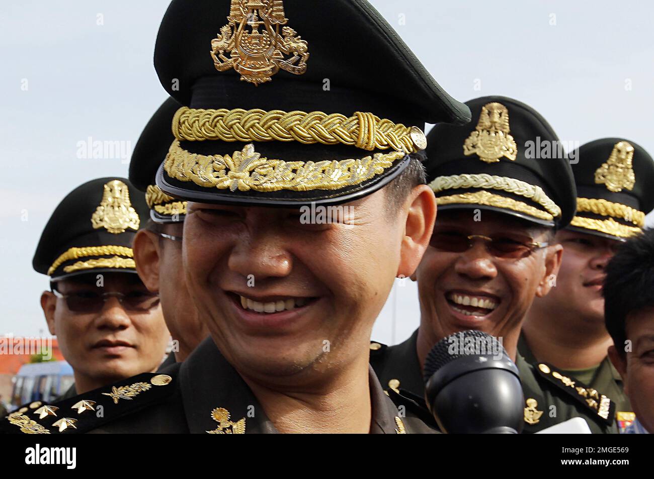 In this Jan. 5, 2017, photo, Lt. Gen. Hun Manet, foreground, smiles as ...