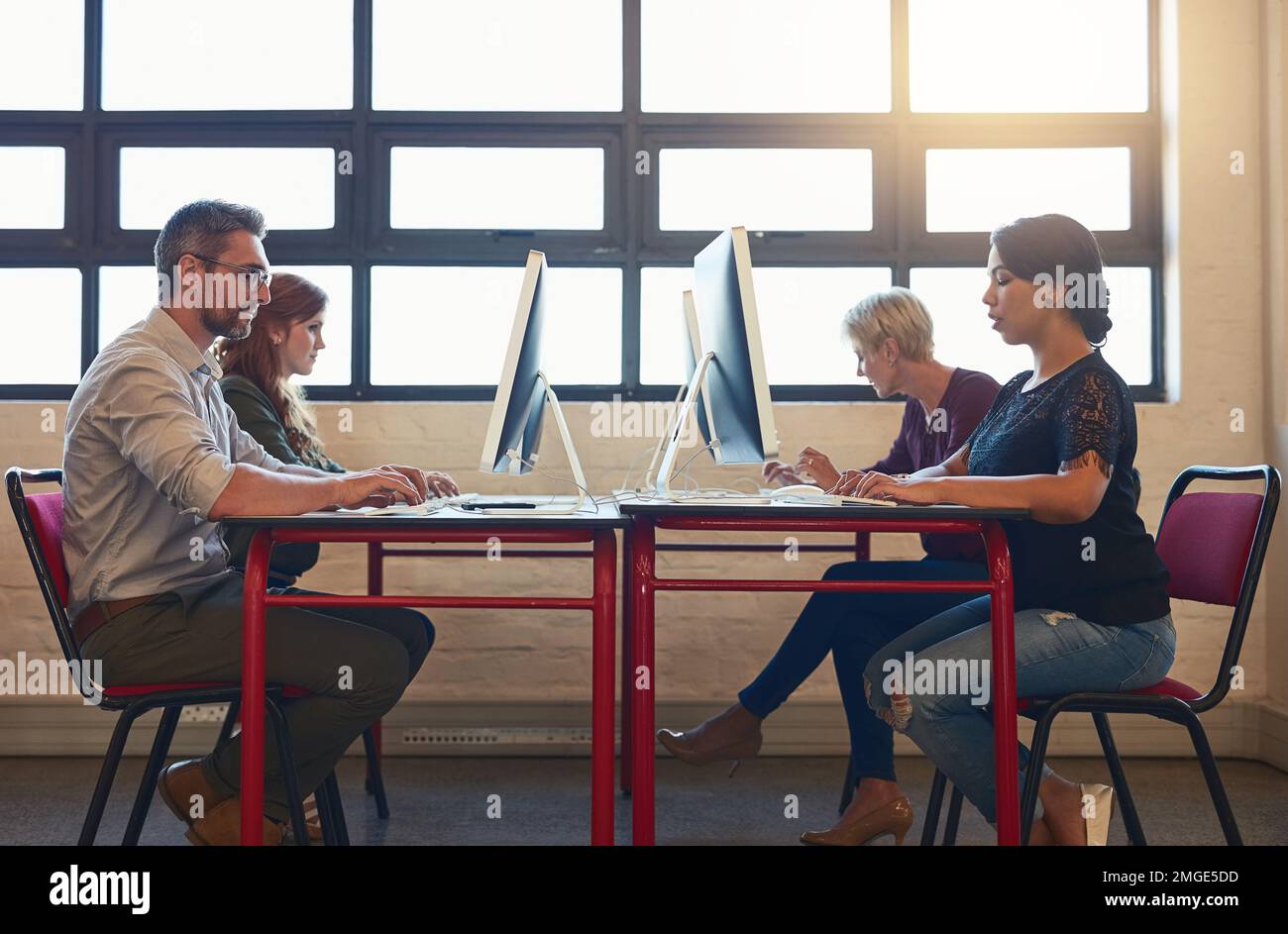 Working hard to become the game changers in business. a group of ...