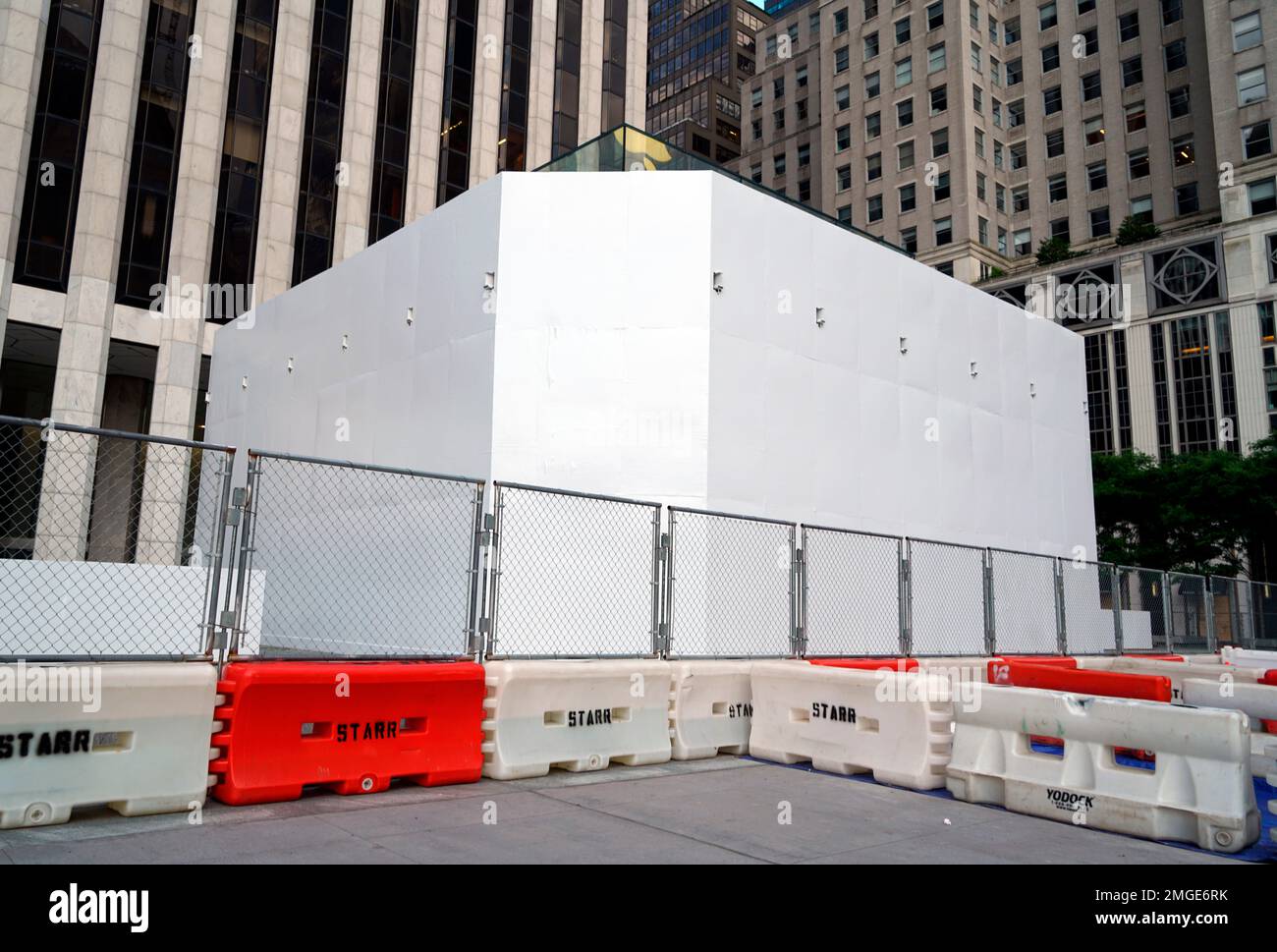 The Apple store on Fifth Avenue in New York is behind barriers and high ...
