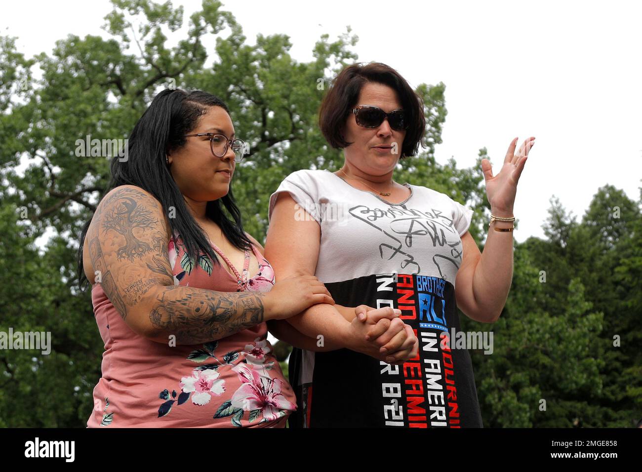 Ashley Quinones, left, widow of Brian Quinones, and Courteney Ross, the ...