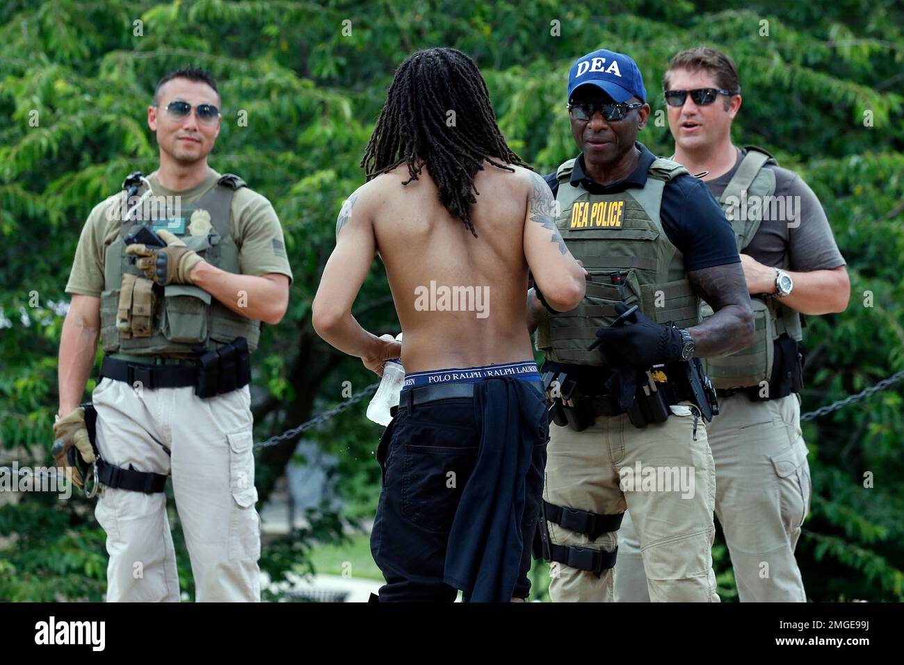 Aaron Covington of St. Louis, fist-bumps a Drug Enforcement Agency ...