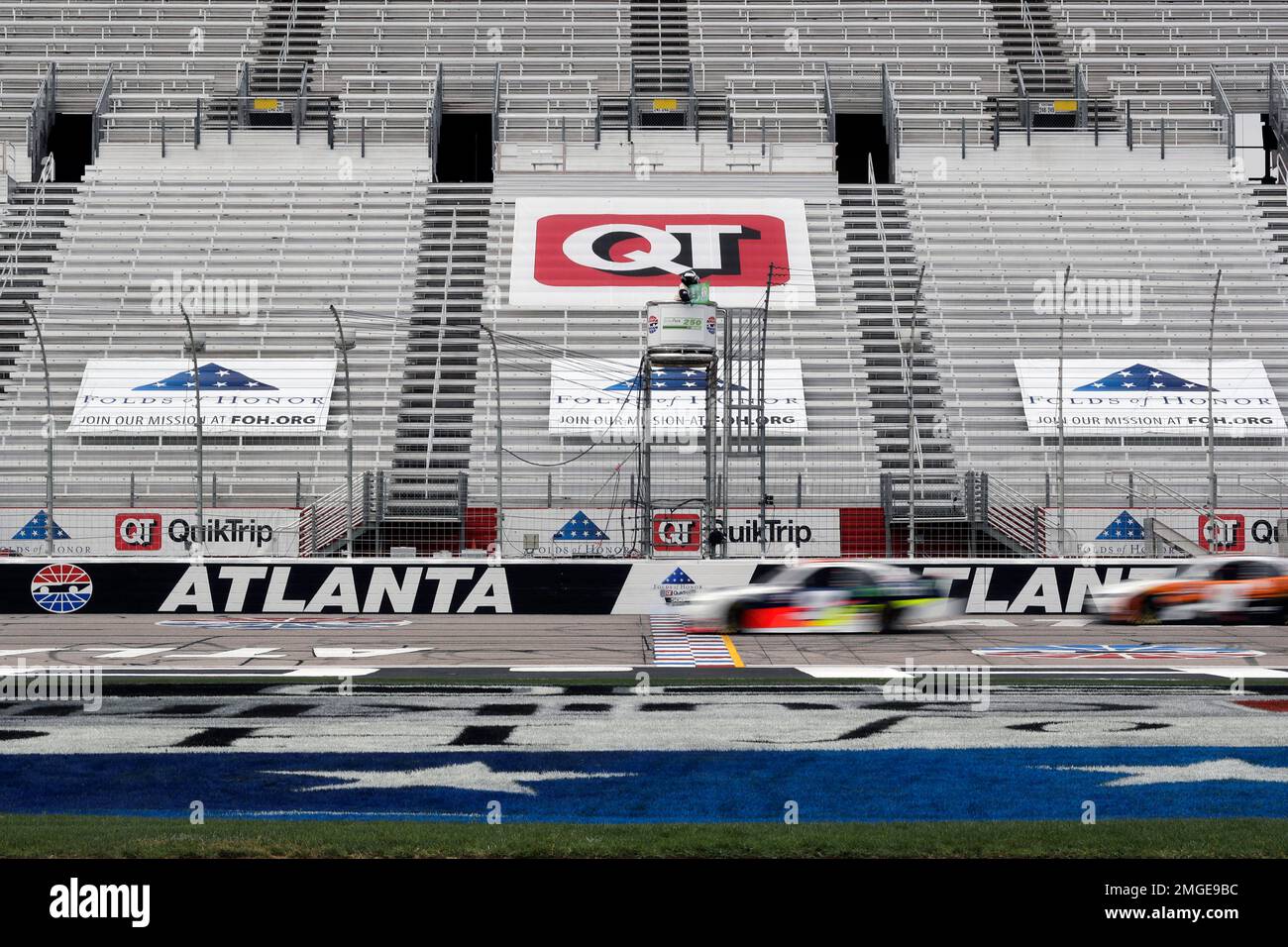 Drivers start a NASCAR Xfinity Series auto race at Atlanta Motor ...