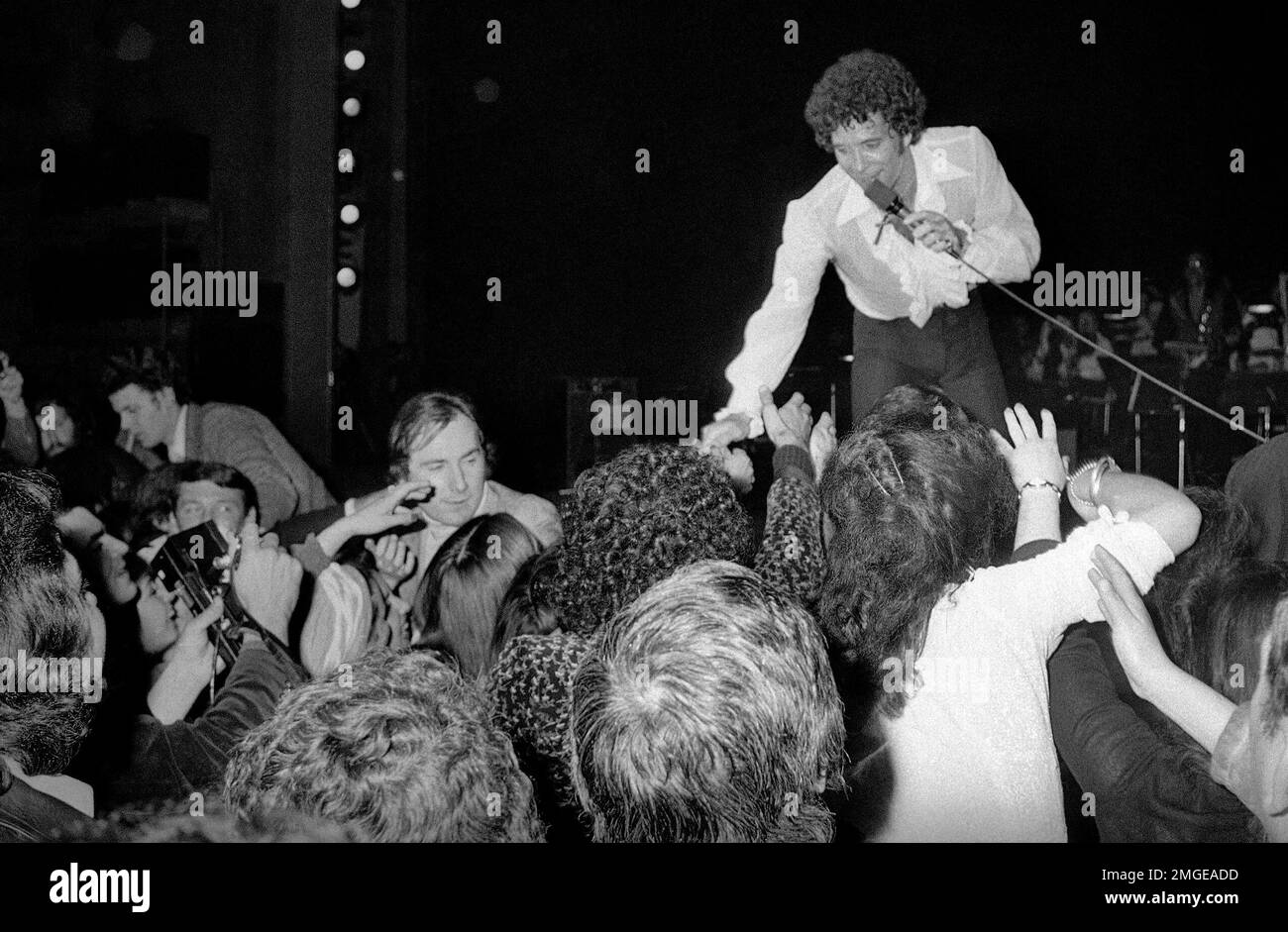 FILE - In this March 16, 1976 file photo, Tom Jones shakes hands with ...
