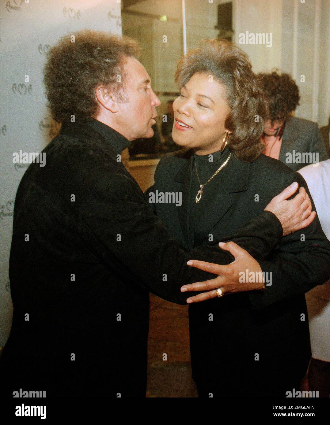 FILE - In this Dec 13, 1994 file photo, Tom Jones kisses Queen Latifah ...