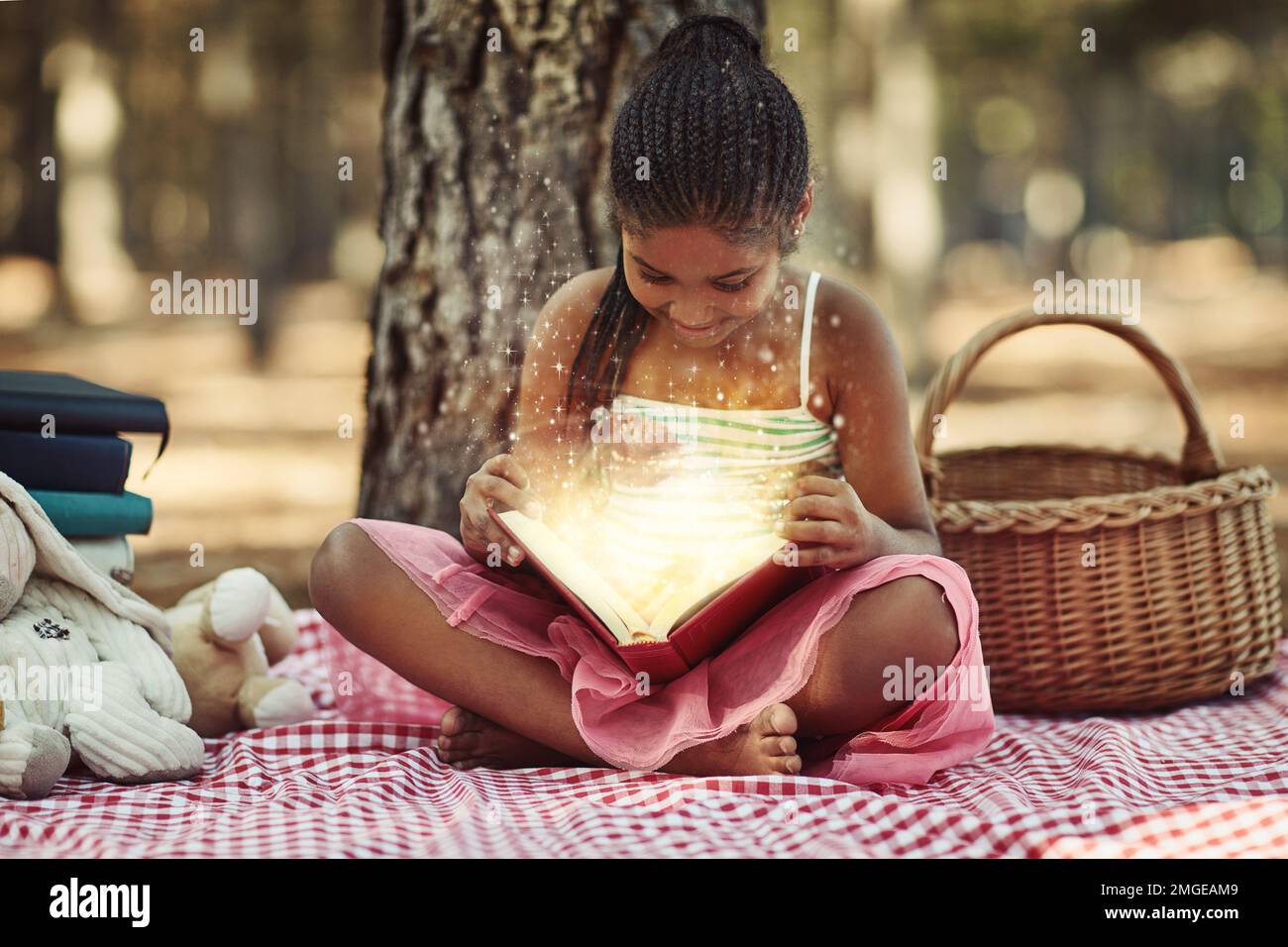 Reading is one way to nurture a childs curiosity. a little girl reading ...