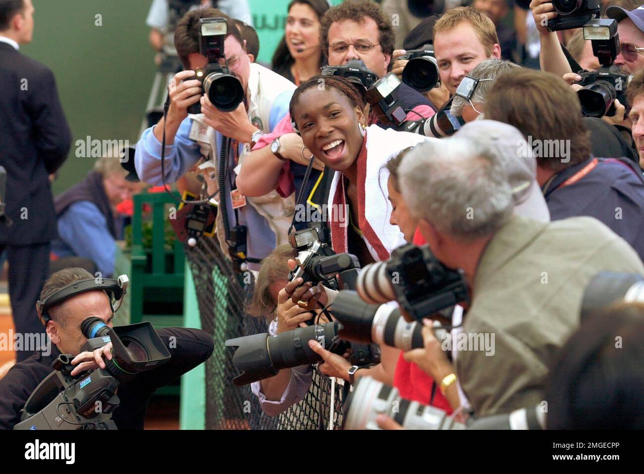 FILE - In this June 8, 2002, file photo, Venus Williams, surrounded by ...