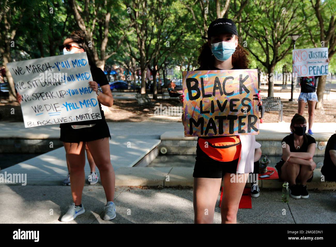 Heather Hogg, font, joins others listening to speakers in Addison ...