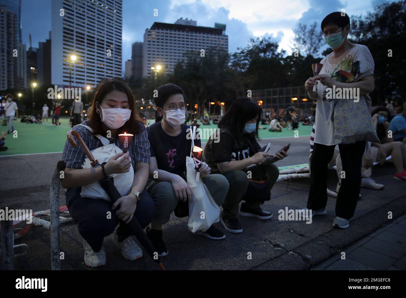 Participants gather for a vigil to remember the victims of the 1989 ...